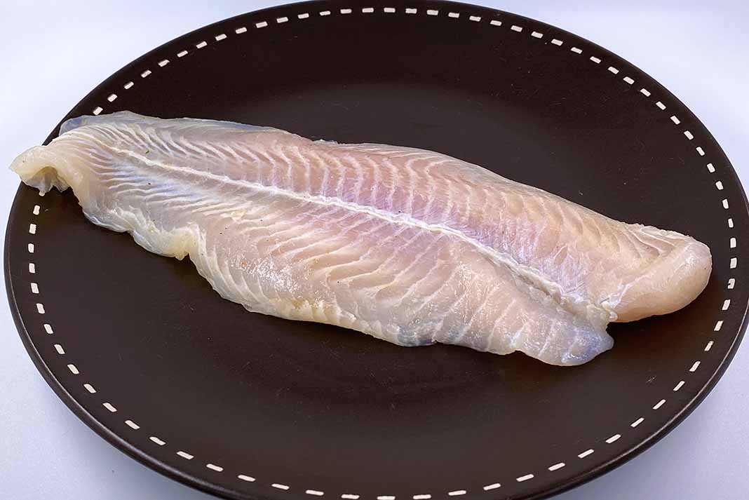 Pescado adobado en hojas de maíz – Chefs Jaime y Ramiro